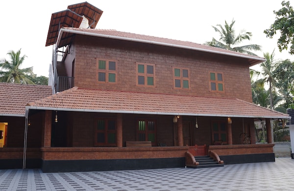"Welcome To Malabar Serenity: Where Tradition Meets Tranquility" - Thalassery