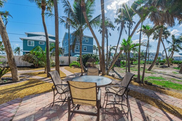 Cozy Getaway | Porch & Shared Outdoor Space | Palmetto Cottage 1 - Fort Myers Beach, FL